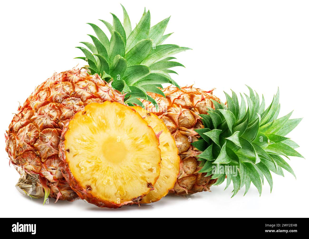 Ripe pineapple and pineapple slices isolated on white background. File ...