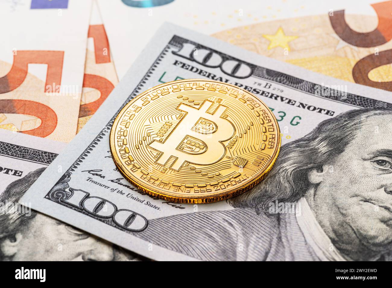 Gold bitcoin coin against the background of traditional currencies ...