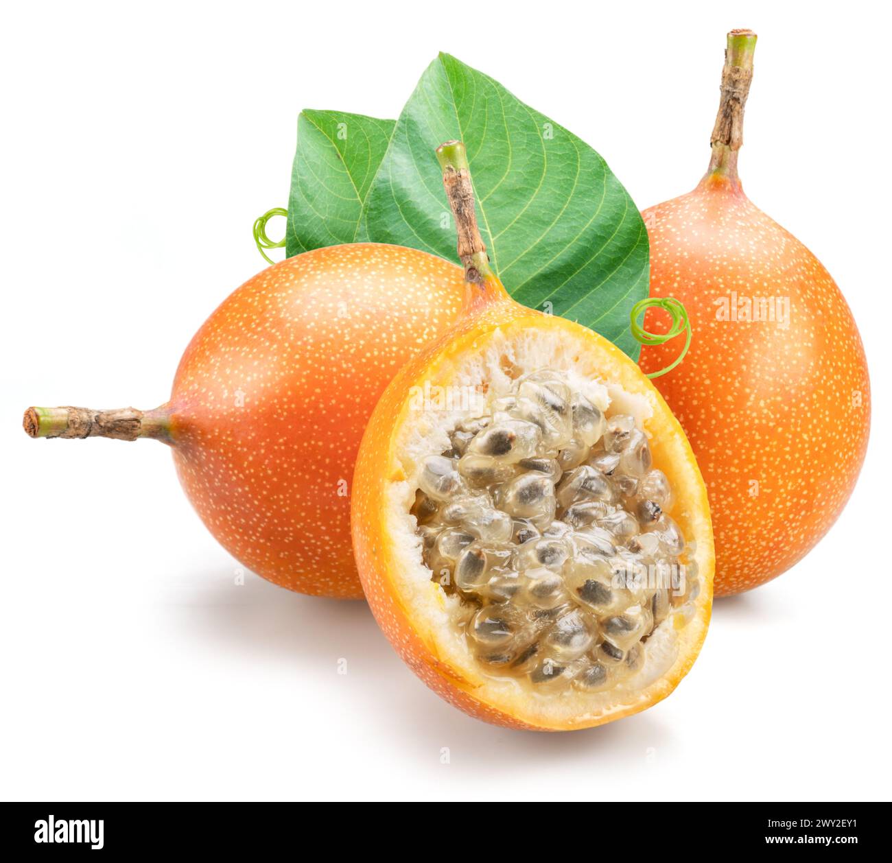 Granadilla and half of granadilla fruit with pulp and black seeds ...