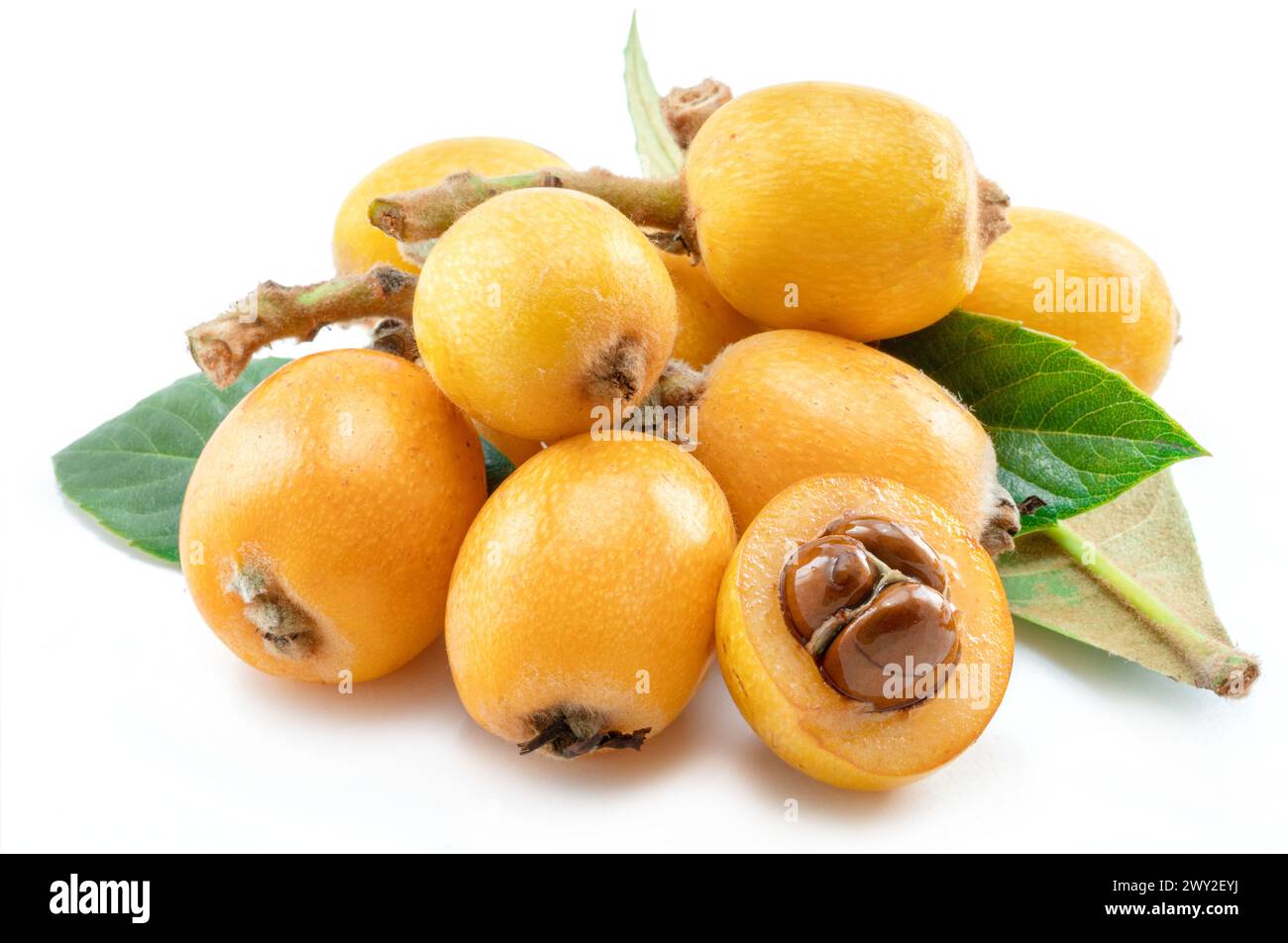 Ripe perfect loquats fruits with green leaves isolated on white ...