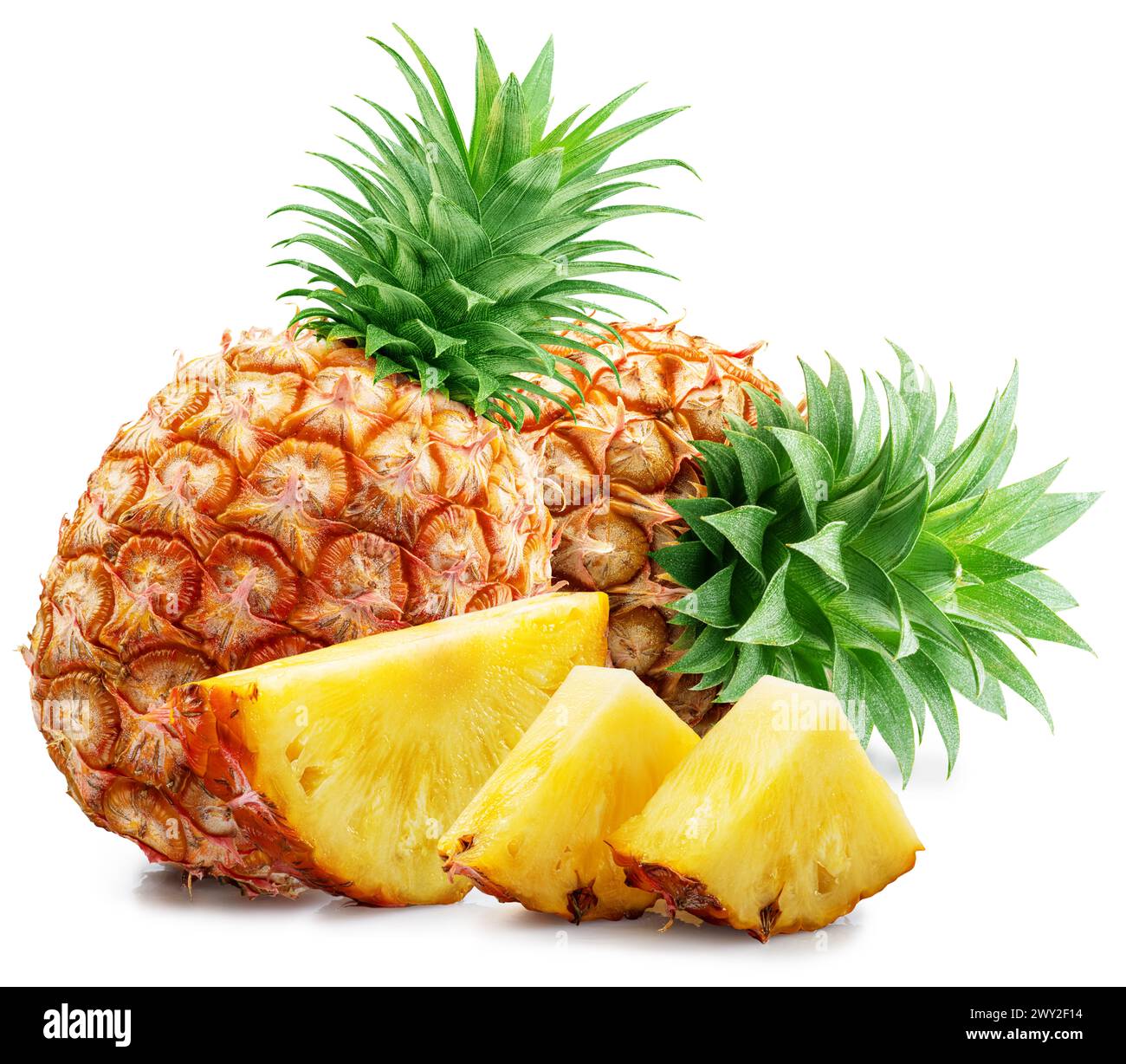 Ripe pineapple and pineapple slices isolated on white background. File ...