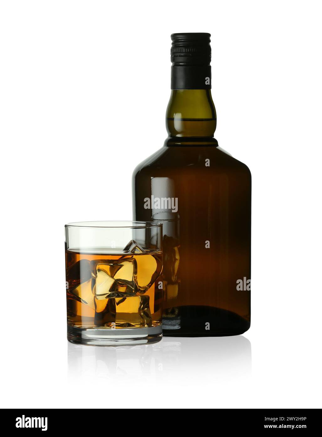 Whiskey in glass and bottle isolated on white Stock Photo - Alamy