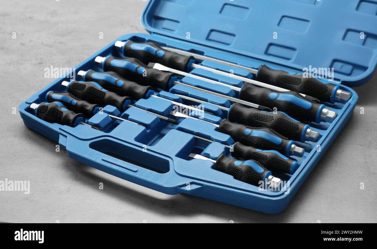 Set of screwdrivers in open toolbox on light table, closeup Stock Photo ...