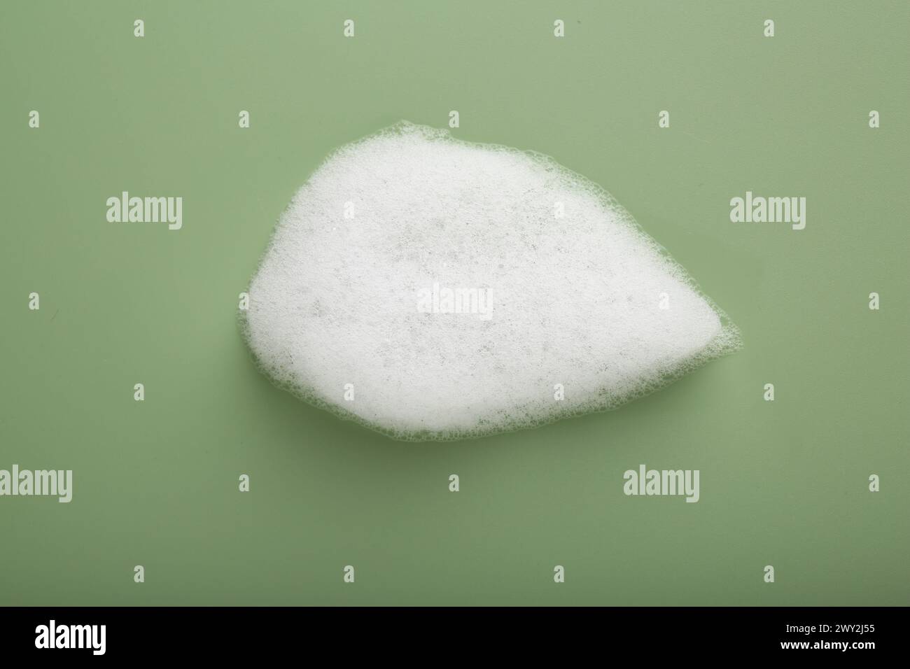 Sample of fluffy foam on green background, top view Stock Photo - Alamy