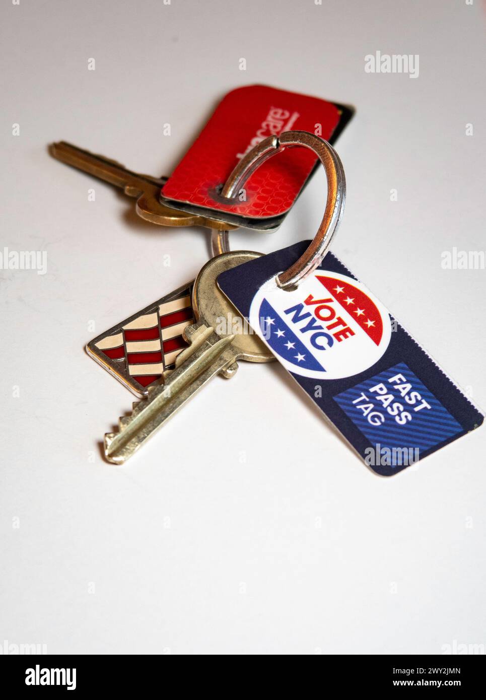 Still life of a keychain with a vote NYC fast pass tag to assist in ...