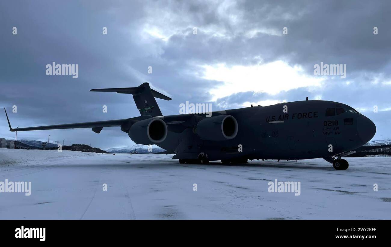 A U.S. Air Force C-17 Globemaster III is shown parked during equipment ...