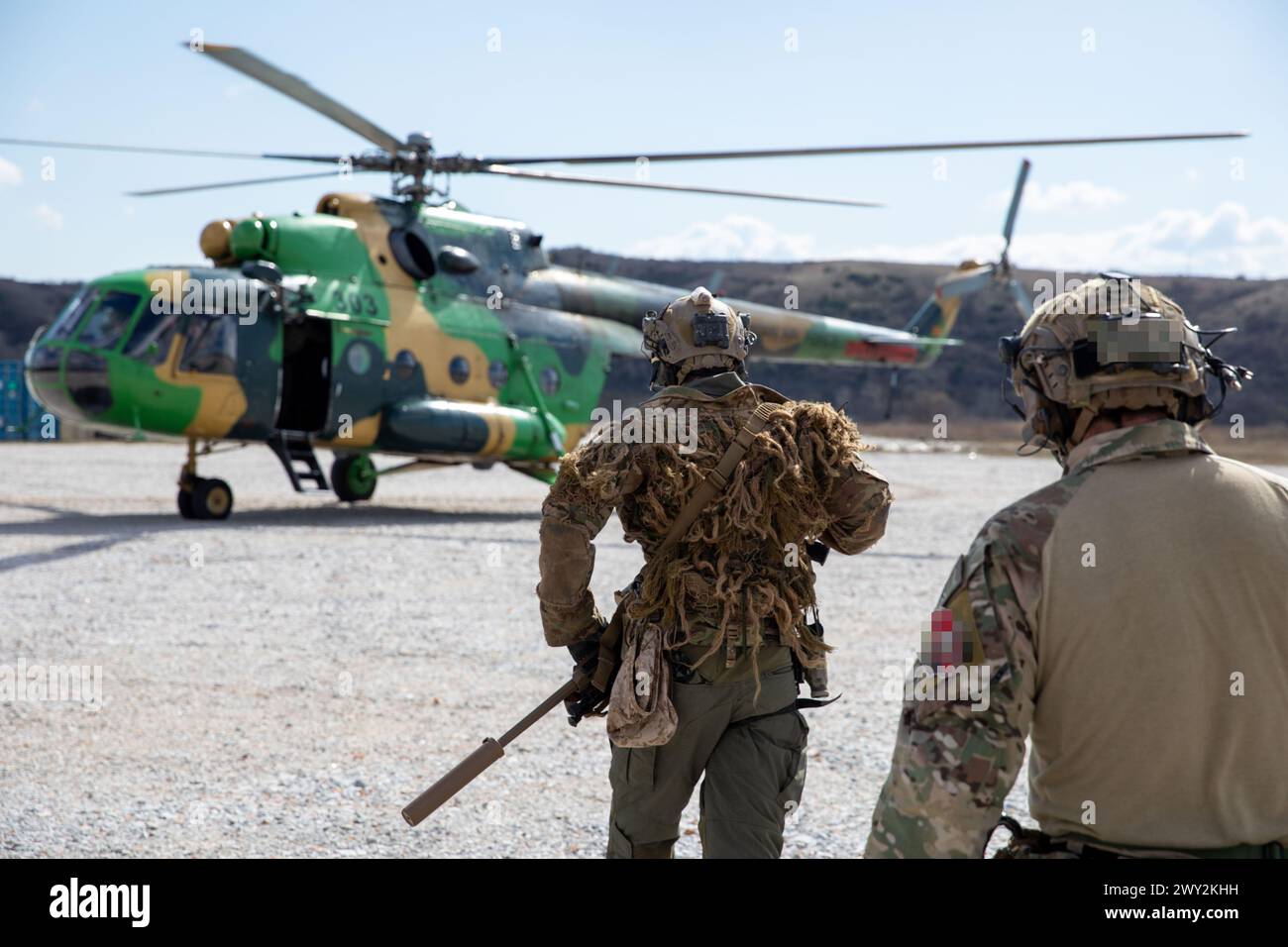 A Green Beret assigned to 10th Special Forces Group (Airborne) moves ...