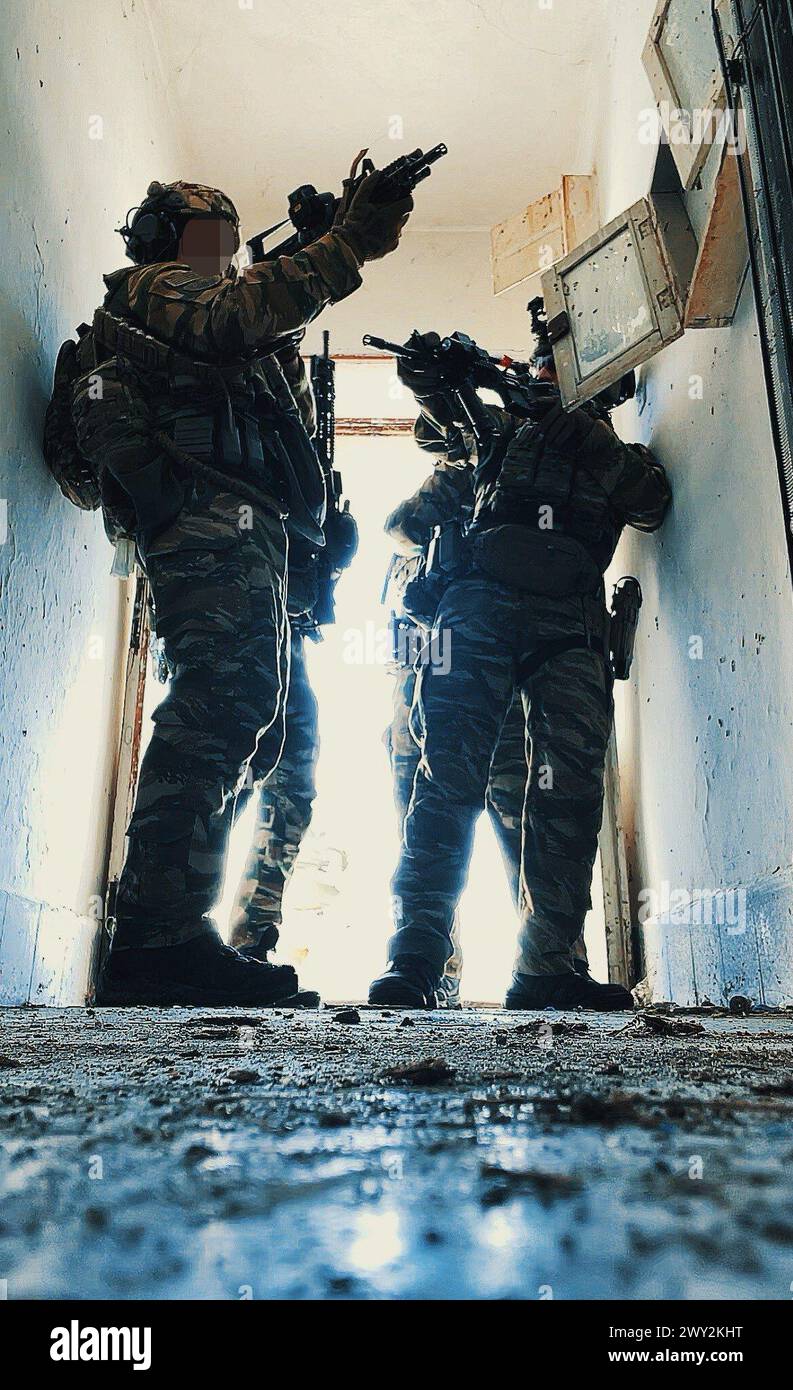 Greek special operations forces soldiers clear a building during Trojan ...