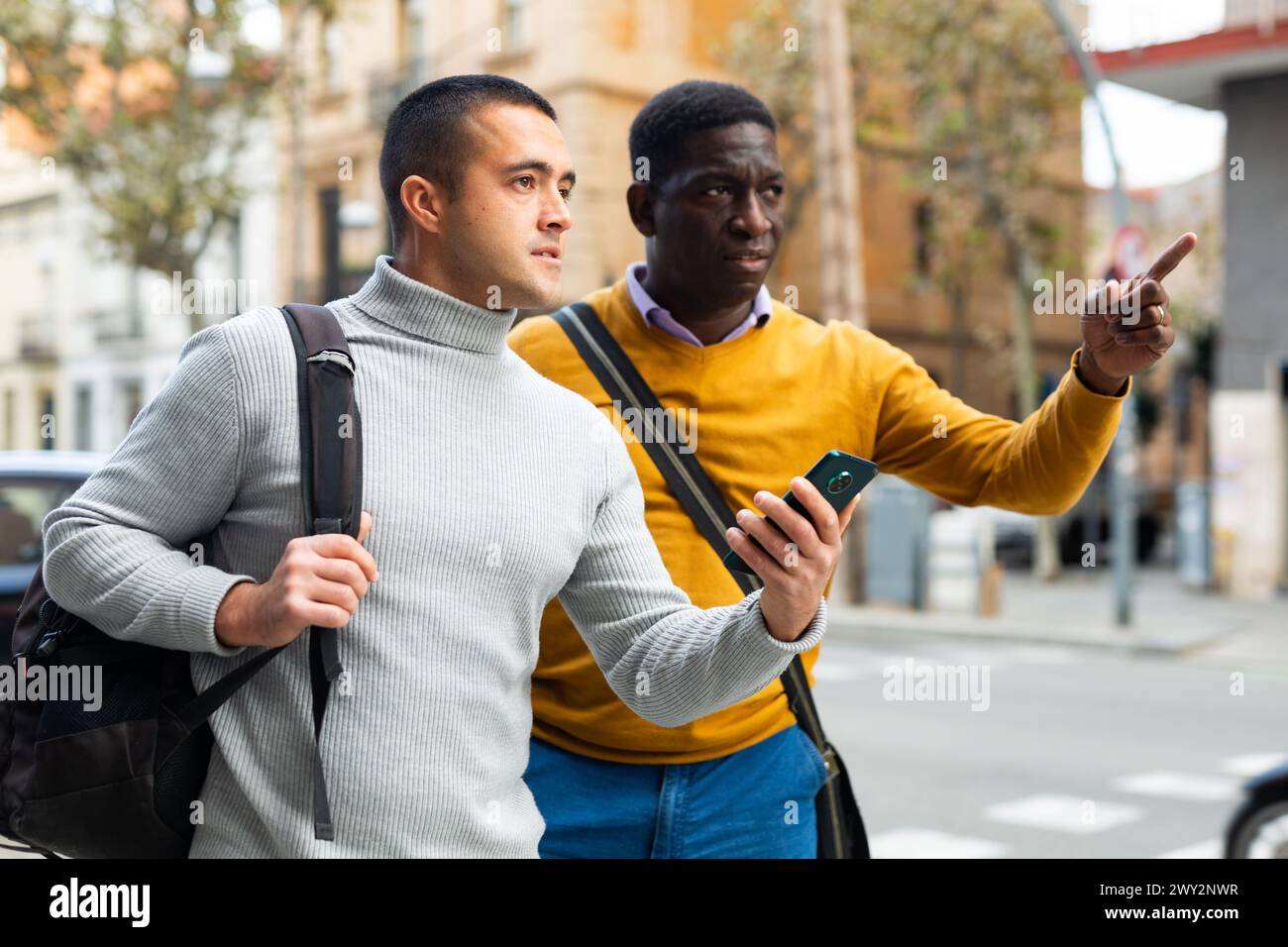 Man with smartphone asking for directions Stock Photo - Alamy