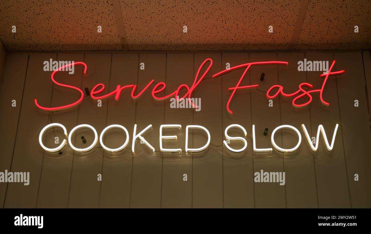 Food neon sign, Served Fast Cooked Slow, Toronto, Canada Stock Photo ...