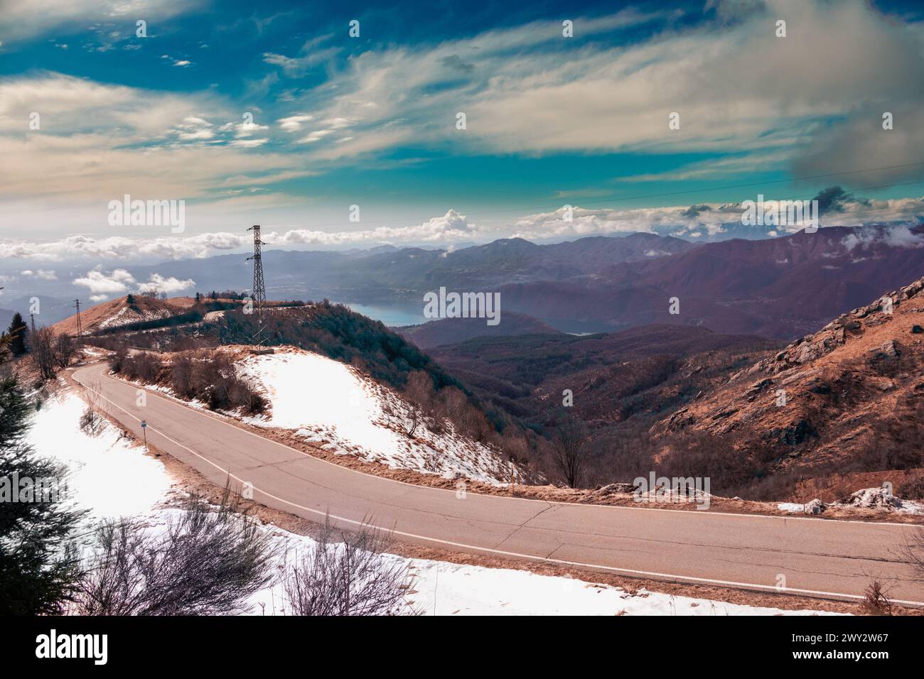 The winding road in the mountains. Panoramic view from Mottarone ...