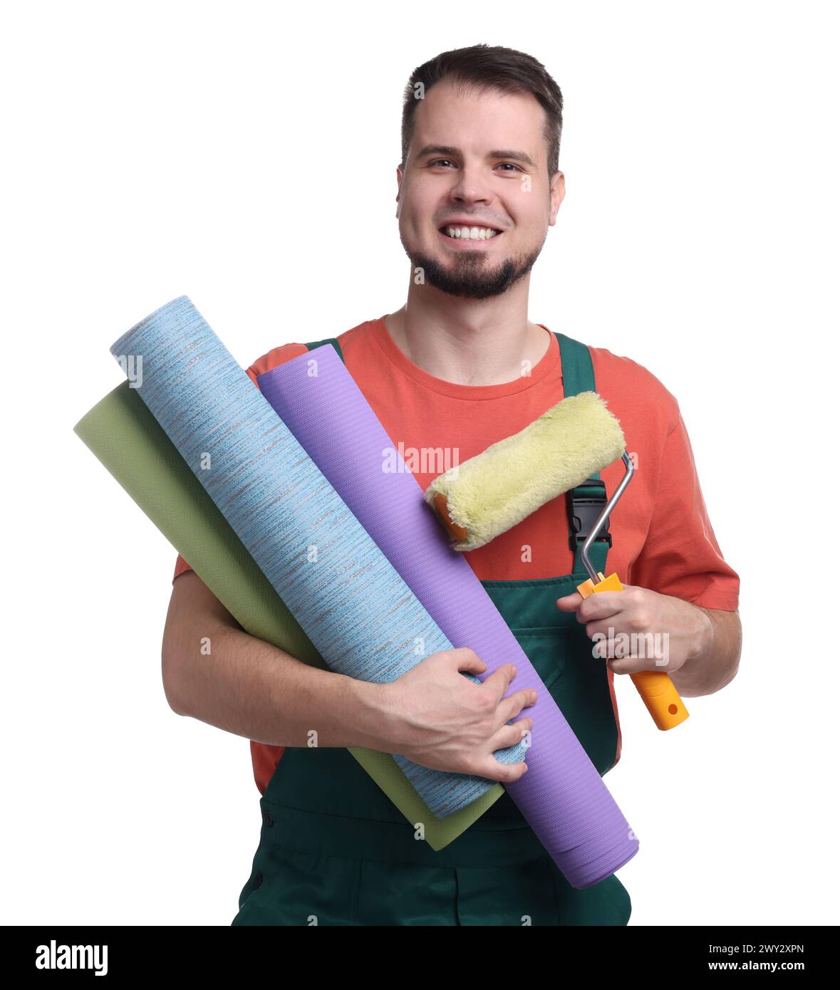 Man with wallpaper rolls and roller on white background Stock Photo - Alamy