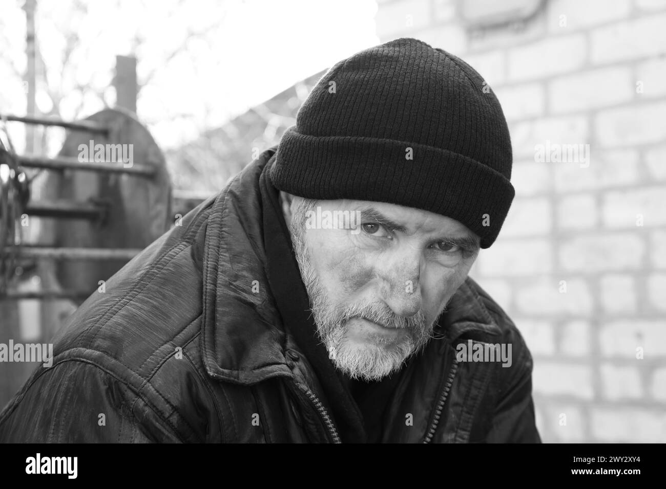 Portrait of poor homeless man with hat outdoors Stock Photo - Alamy