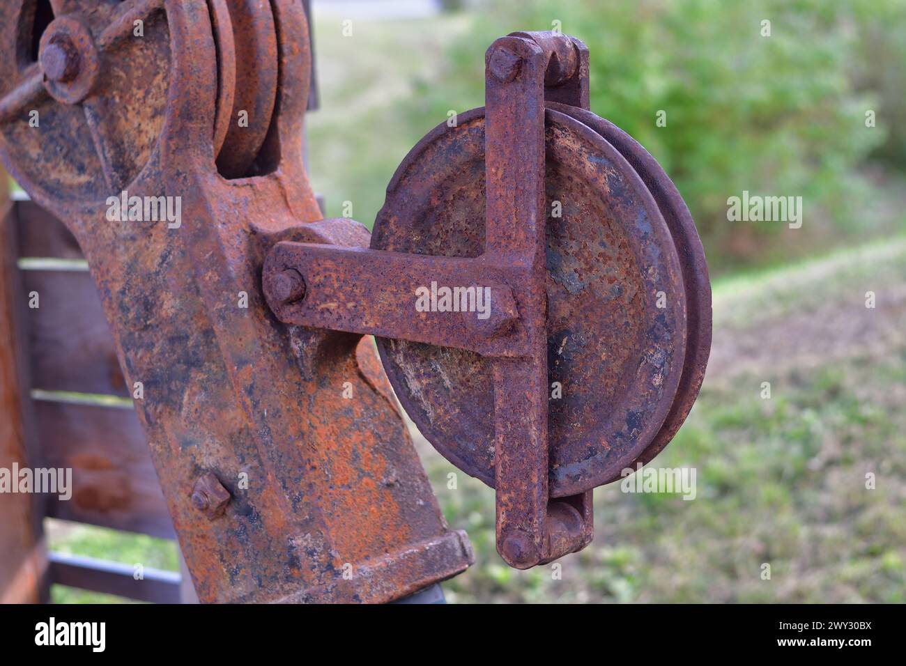Old mining sheaves. Rusted vintage mining pulleys Stock Photo - Alamy