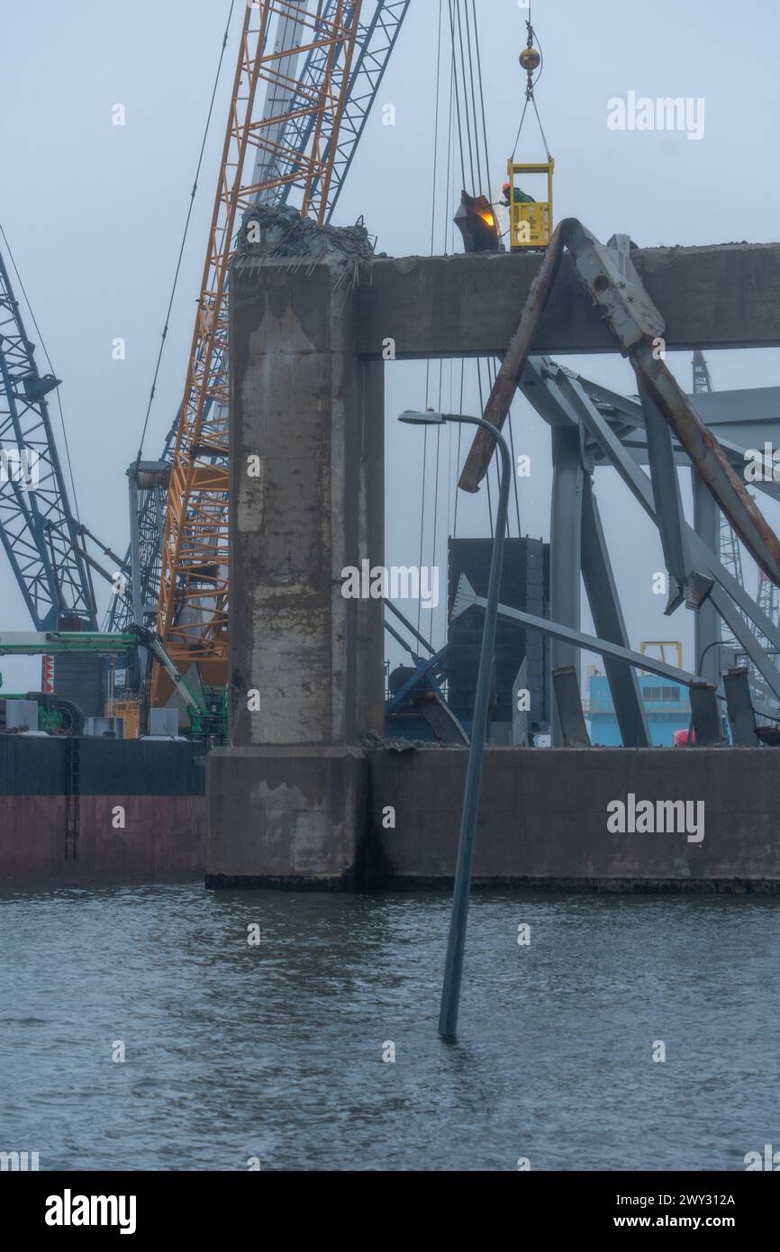 Highly trained salvage operations personnel use an exothermic torch to ...