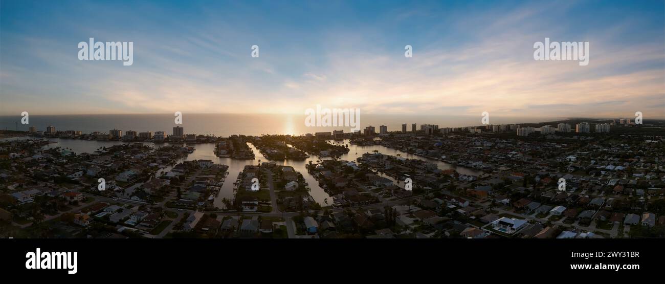 Sunset aerial sky view of Vanderbilt Beach and the ocean in Naples ...