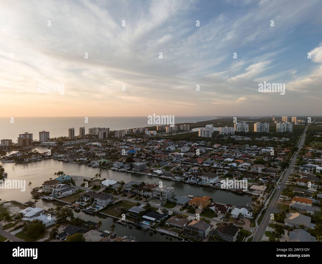 Sunset aerial sky view of Vanderbilt Beach and the ocean in Naples ...