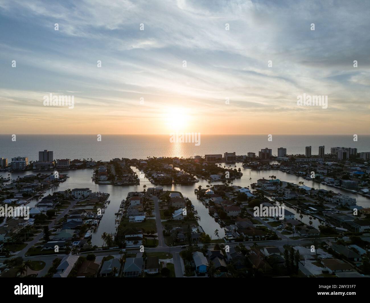Sunset aerial sky view of Vanderbilt Beach and the ocean in Naples ...