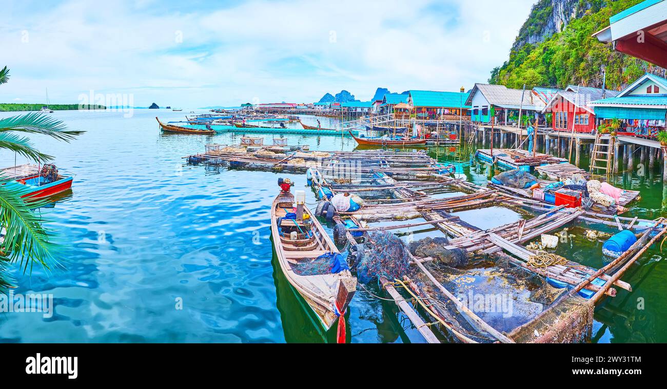 Panorama with fish farms and old fishing boats at the shore of Ko Panyi ...