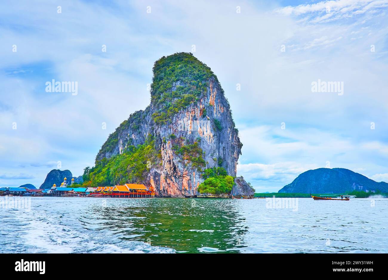 The scenic landscape of Ko Panyi Island and colored roofs of floating ...