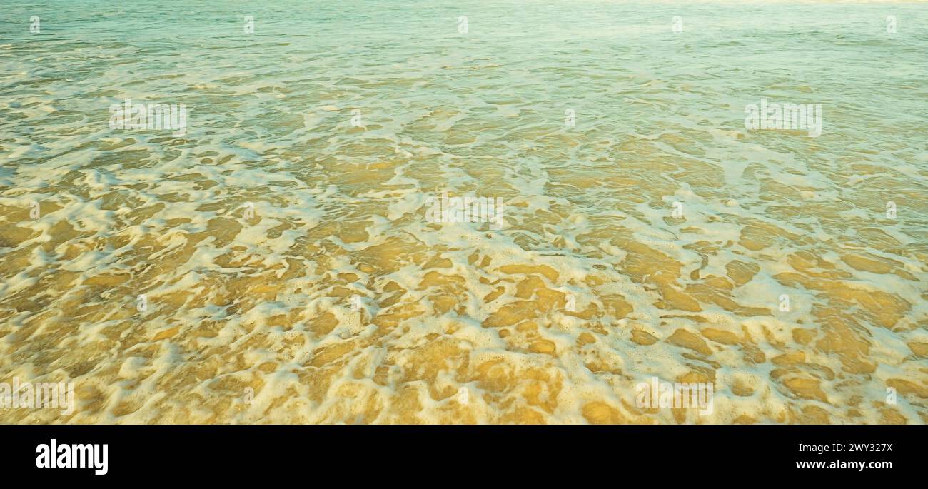 Ocean background of shallow sea water foaming and churning sand Stock ...