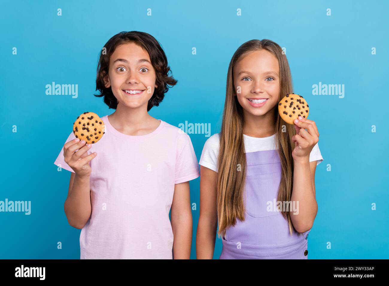 Photo of funky excited friends wear casual outfits enjoying tasty ...