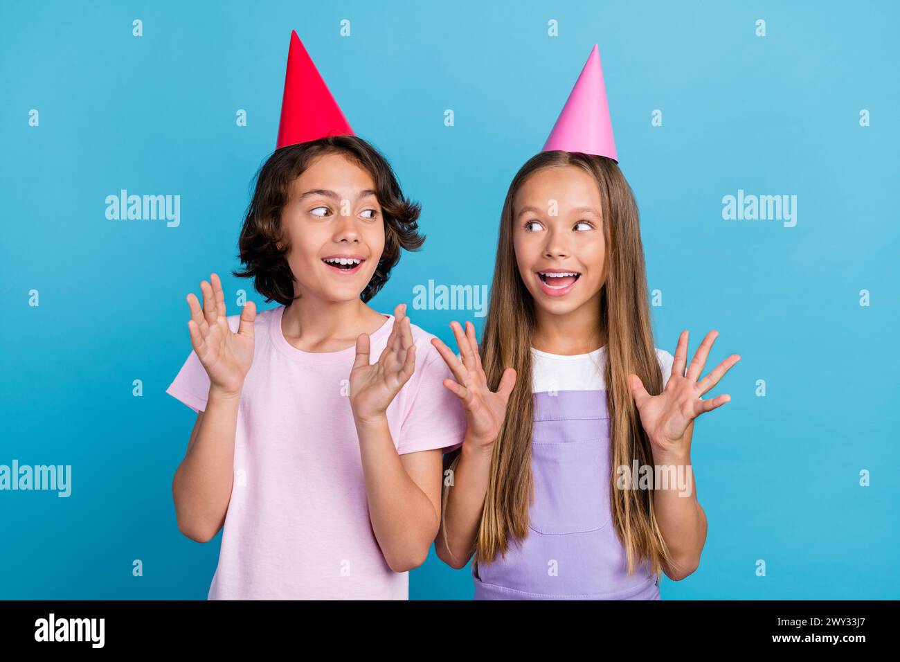 Photo of funky impressed friends wear casual outfits birthday headwears ...