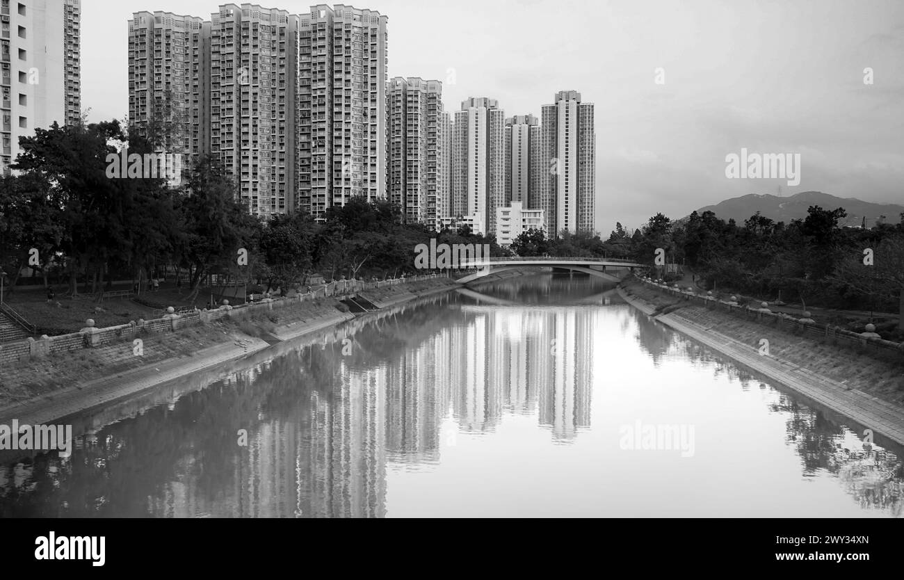 Tin Shu Wai, Hong Kong, residential buildings reflected in the waters ...