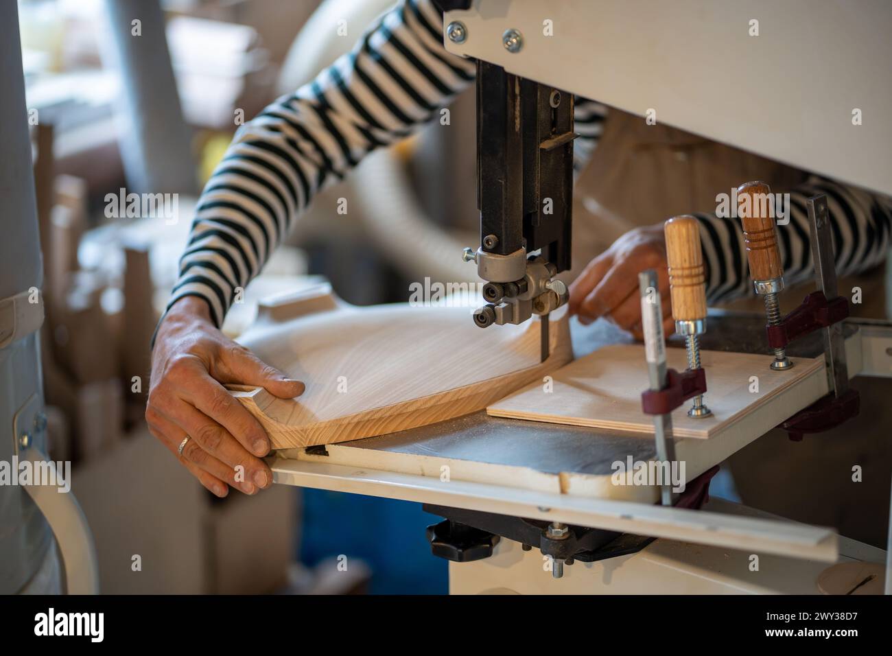 Carpentry workshop, craftsman master working. Joiner hands carved on ...