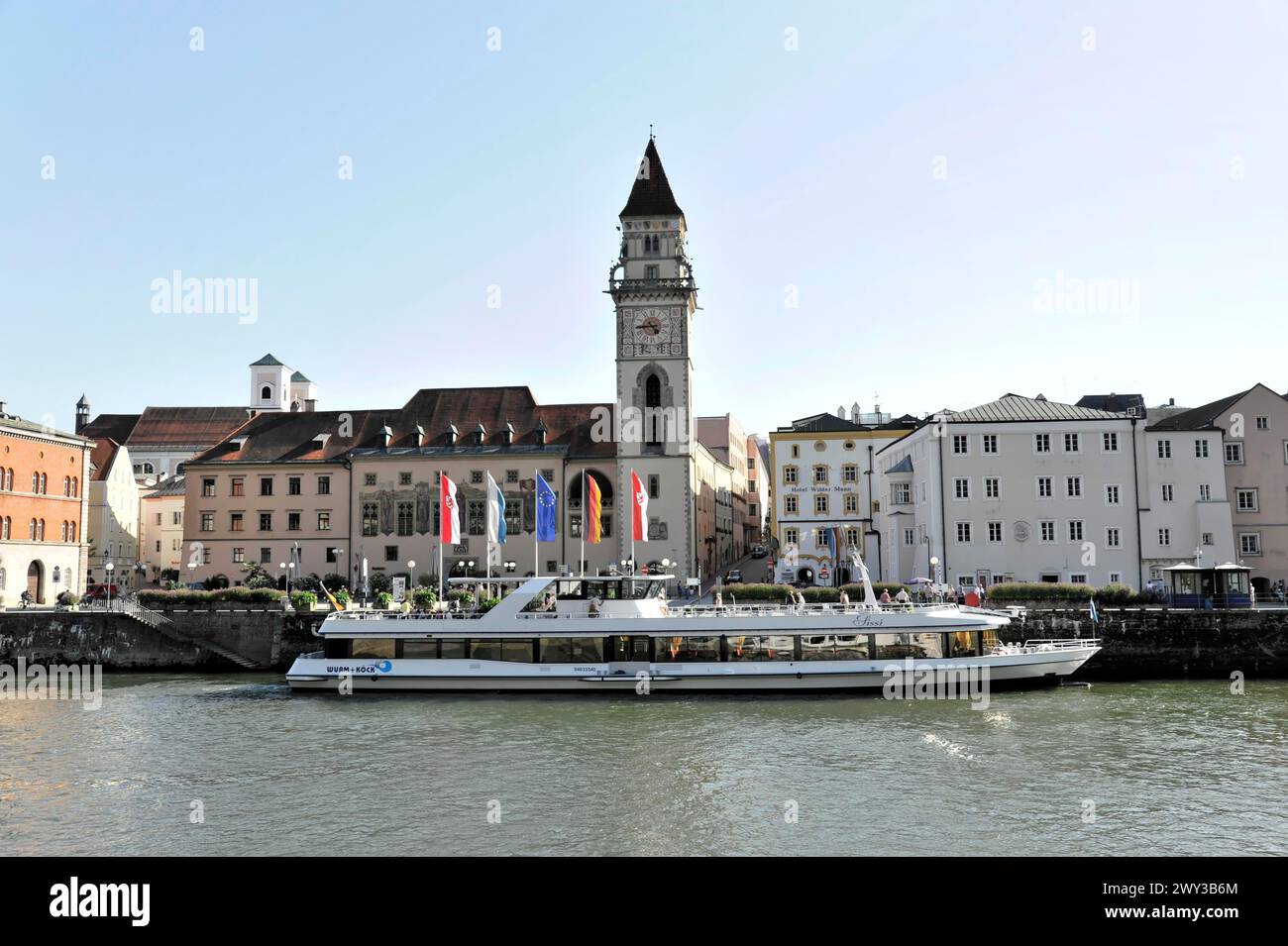 Ships on the river (Danube) in front of a town with a prominent church ...