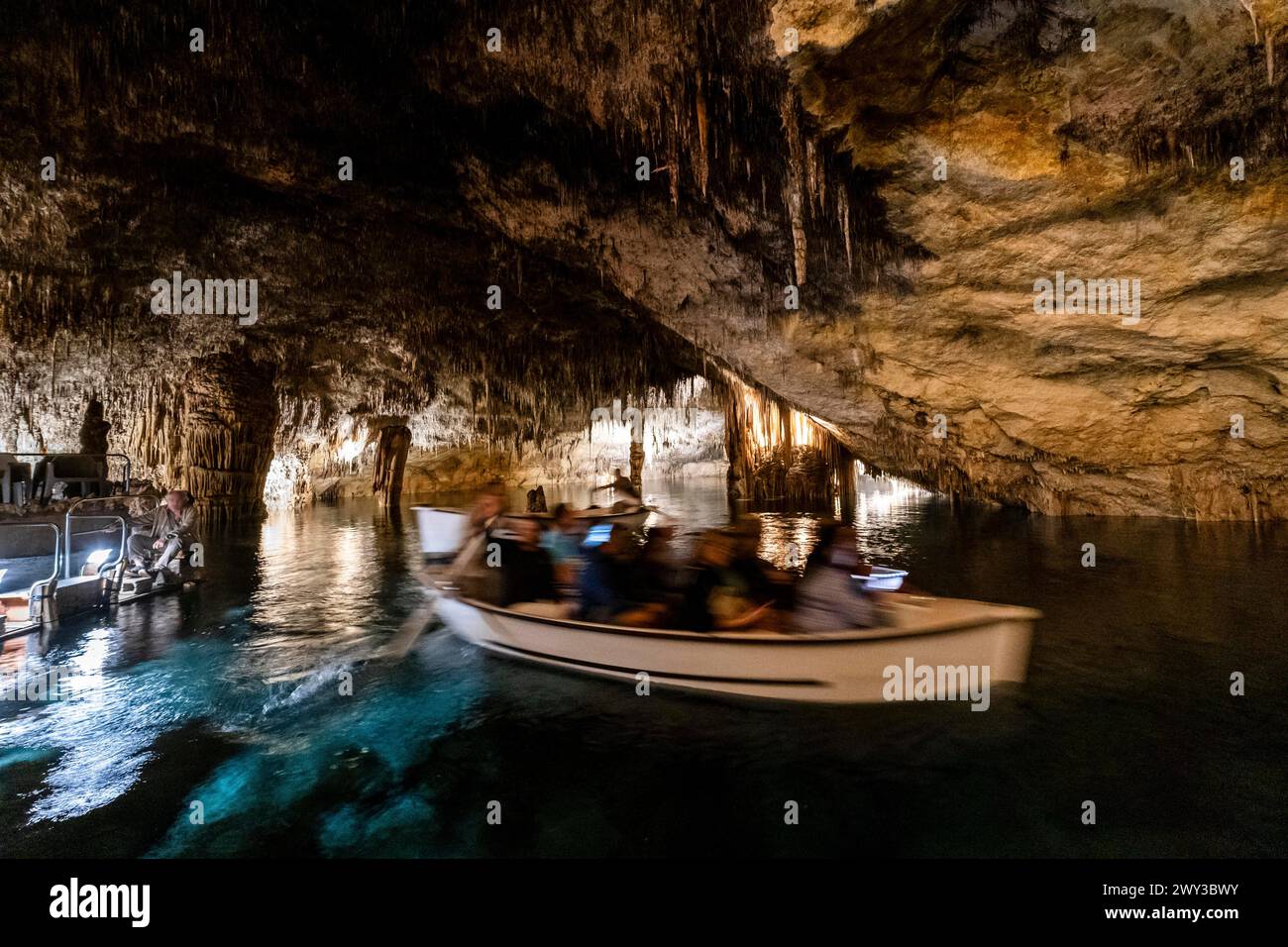 People in the boat on lake in amazing Drach Caves in Mallorca, Spain ...