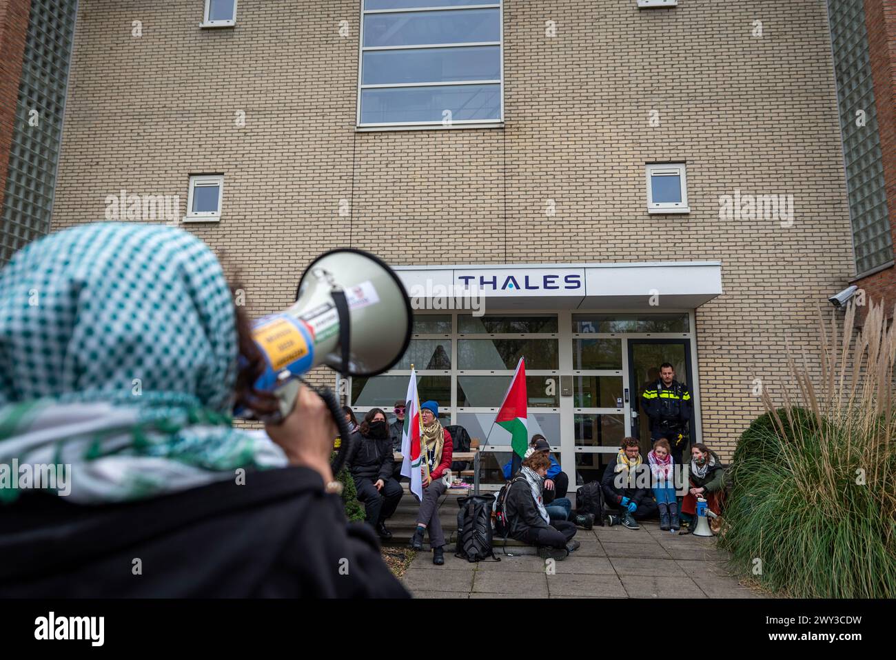 Delft, South Holland, Netherlands. 3rd Apr, 2024. An activist chants ...