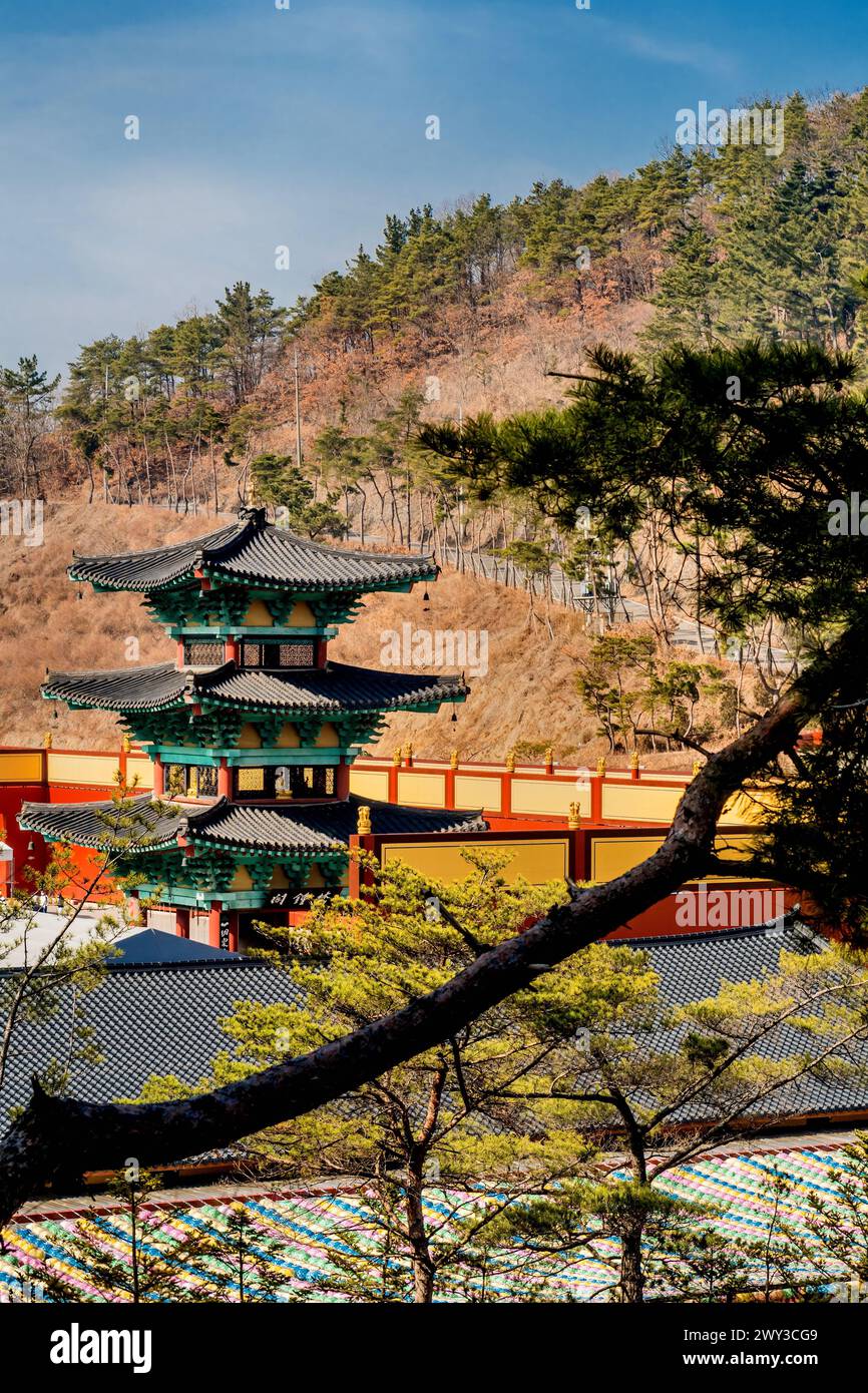 Bell tower pavilion seen through trees at Manbulsa Buddhist Temple in ...