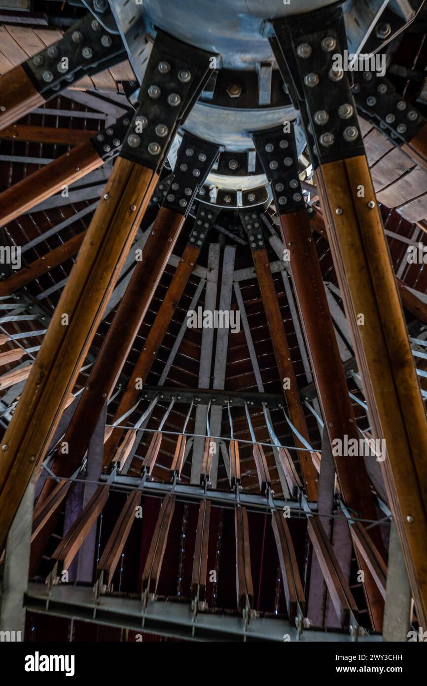 View of wooden observation tower taken from ground level looking up ...