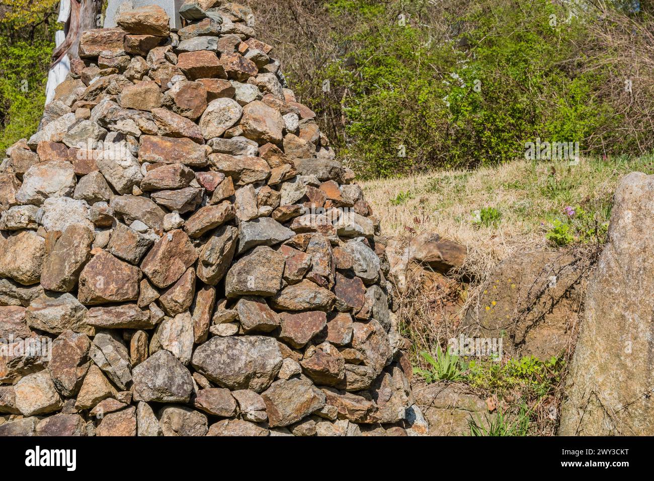 Closeup of stacked rock pyramid in wilderness park on sunny day in ...