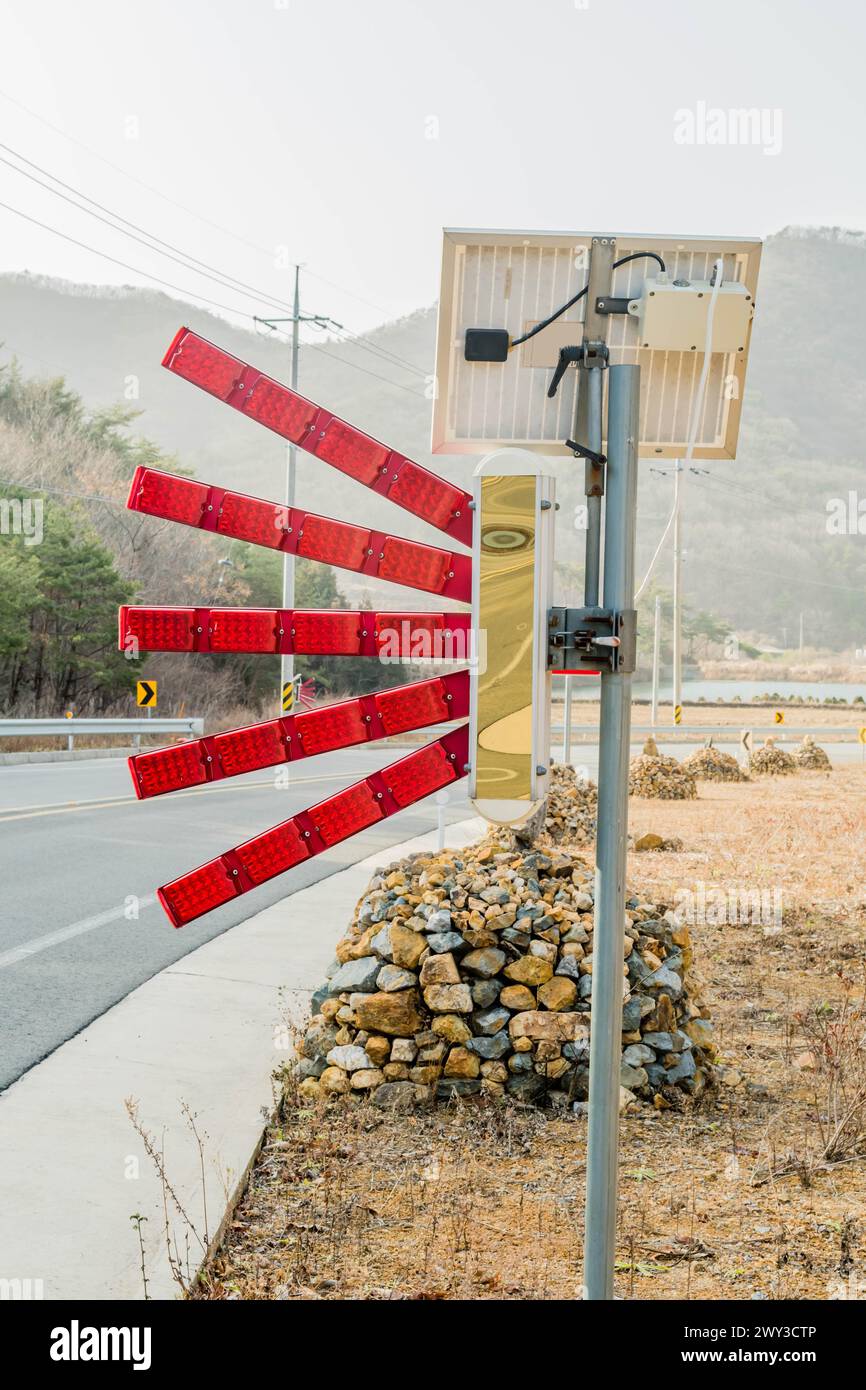 Fan shaped red warning light bars powered by solar cell on rural ...