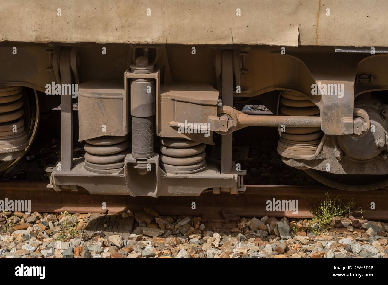 Close-up of train wheels on rail tracks, showcasing the mechanical ...
