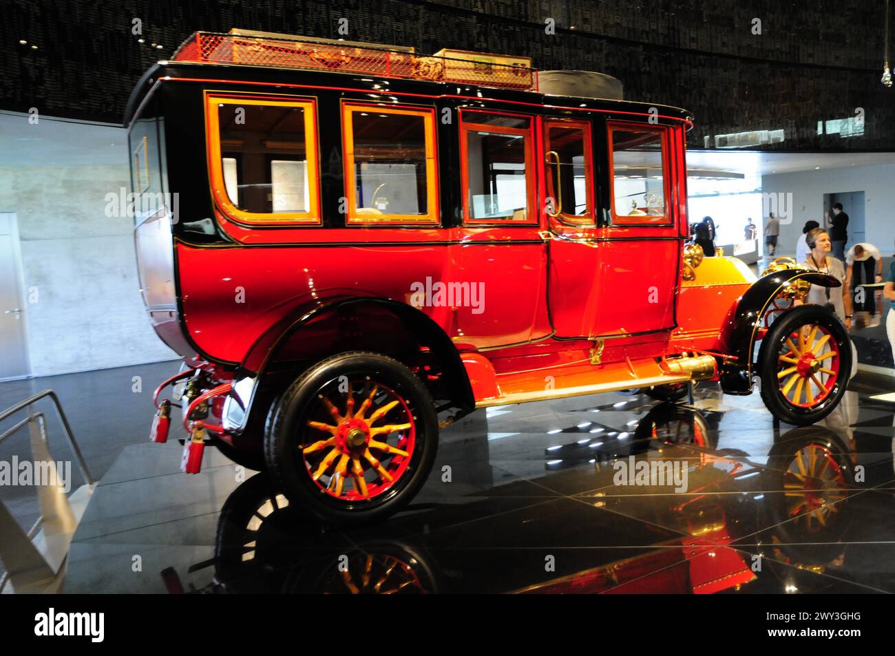 Historic red Mercedes-Benz bus from the early years of motor vehicle ...