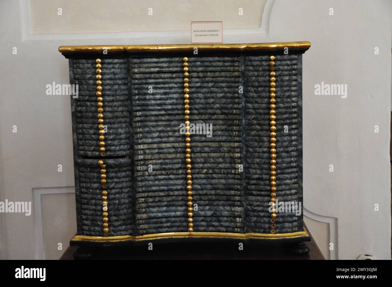 Langenburg Castle, Black antique chest of drawers with gold-coloured ...