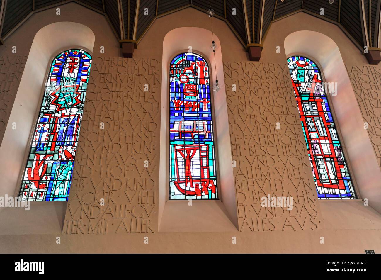 Speyer Cathedral, Colourful stained glass windows next to a wall with ...