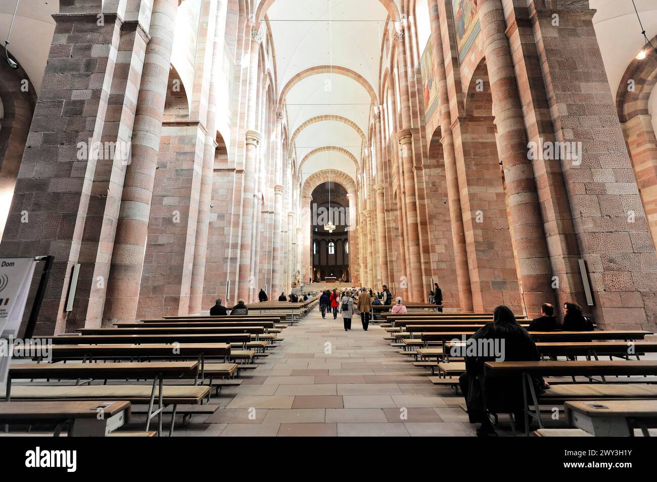 Speyer Cathedral, majestic church interior with people walking between ...