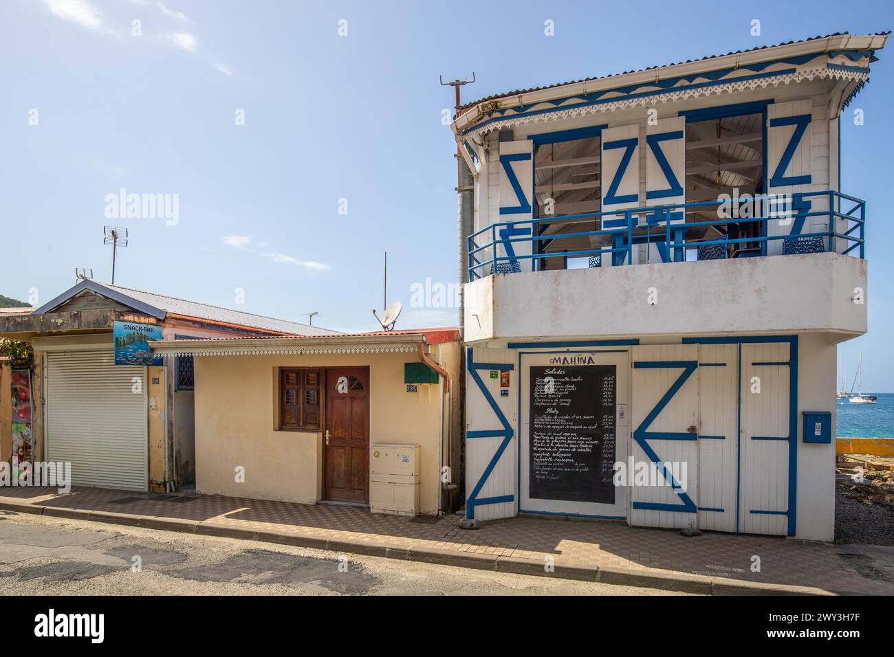 Deshaies, historic Caribbean wooden building of a street in Guadeloupe ...