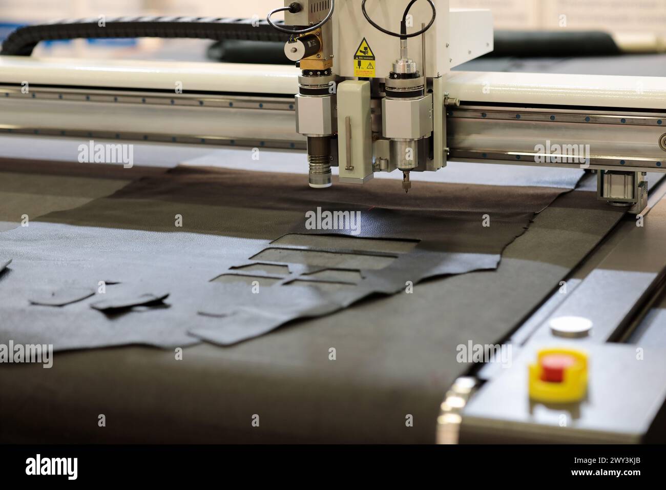 Automatic flatbed digital cutting system close up. CNC leather cutting ...