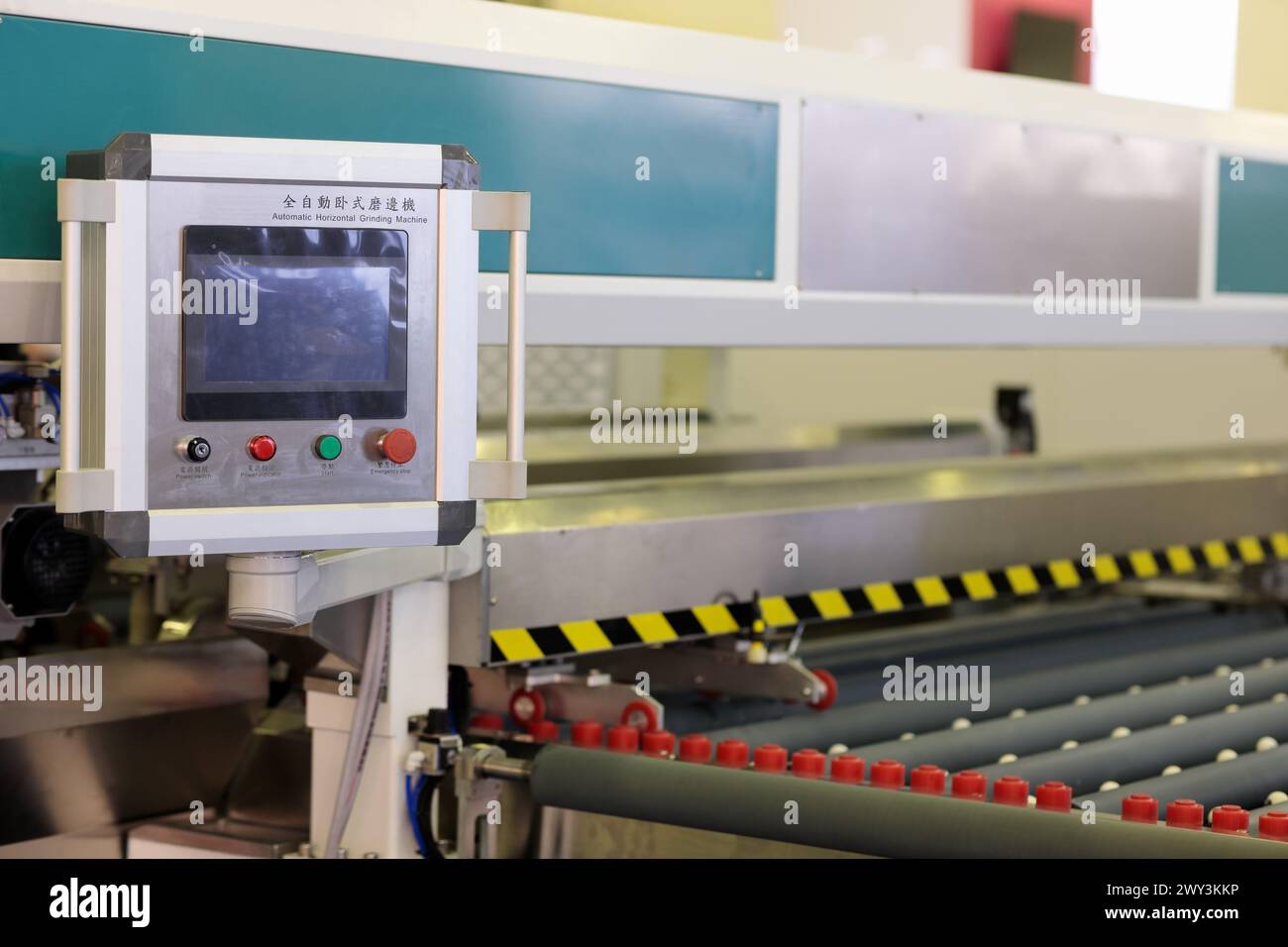 Automatic horizontal glass edge grinding machine. Selective focus Stock ...