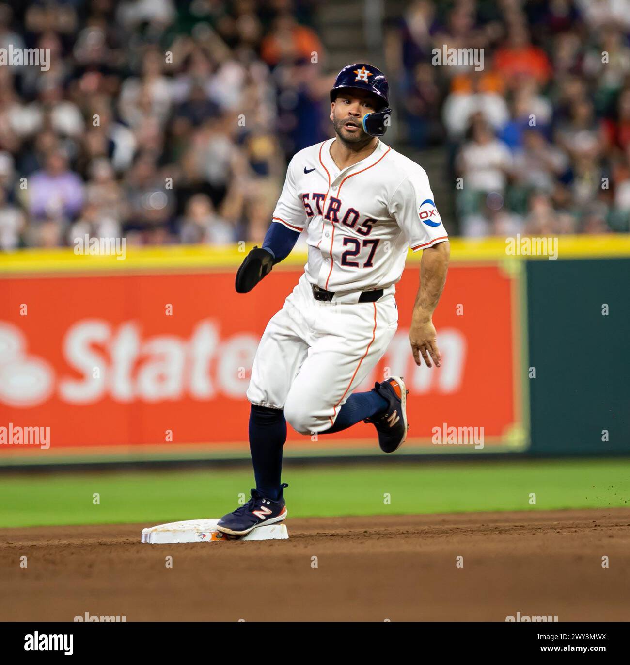 Houston, Texas, USA. 3rd Apr, 2024. Astros second baseman JOSE ALTUVE (27) rounds second base ...
