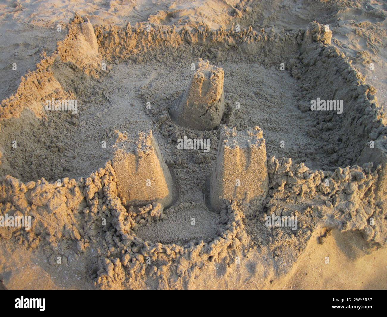 sand castle on the beach in the sunset Stock Photo - Alamy