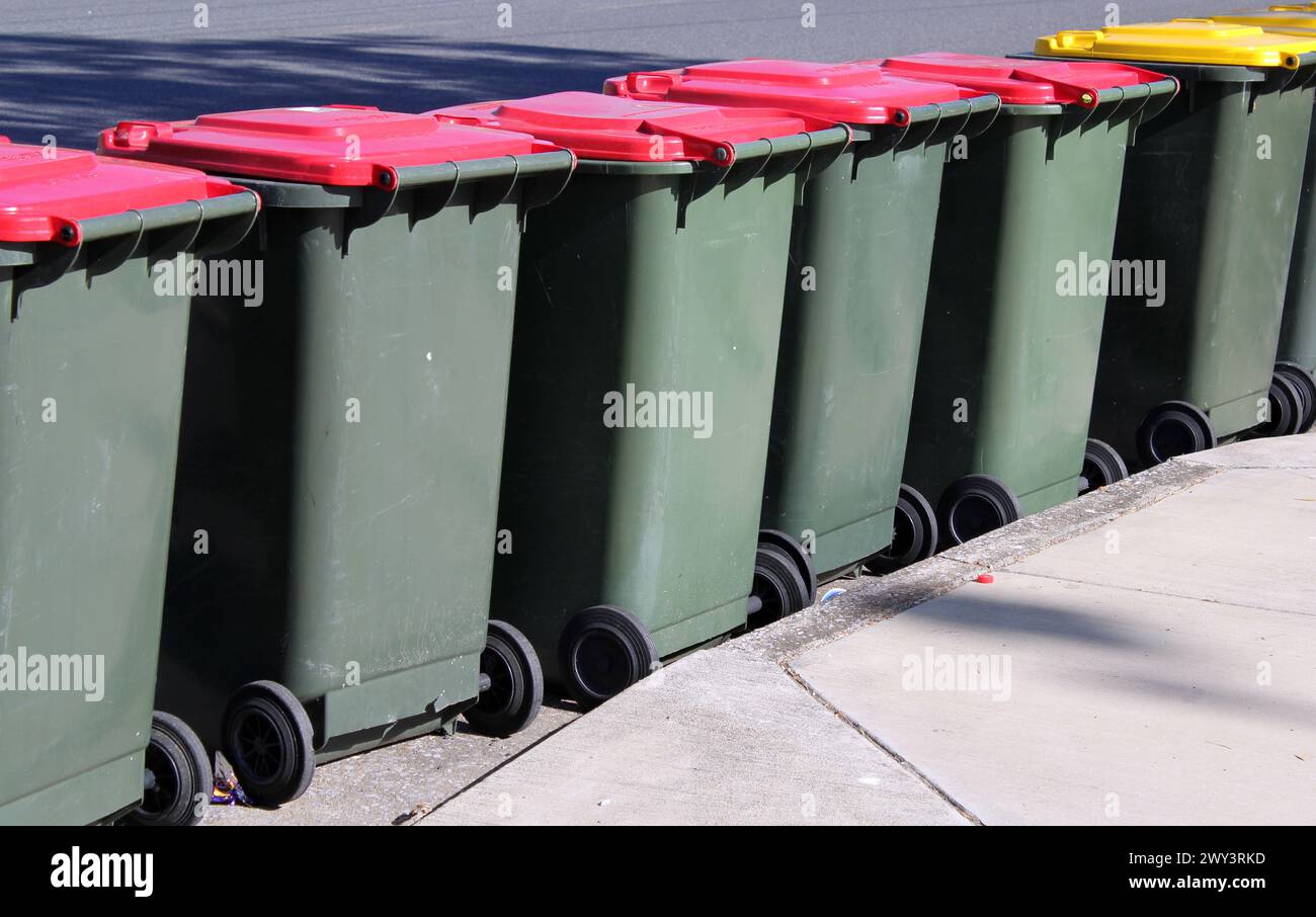 Row of rubbish bins on a street Stock Photo - Alamy