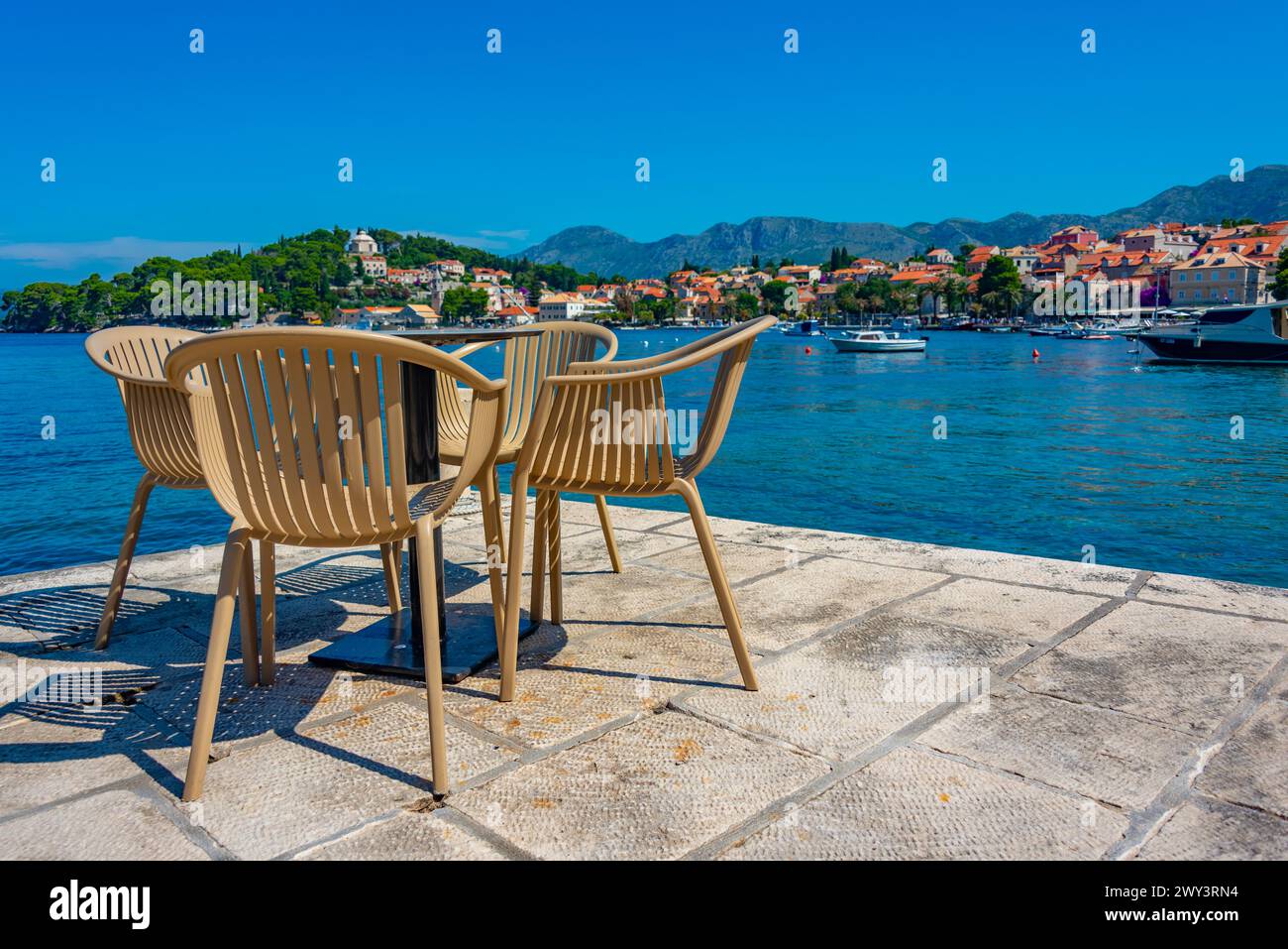 Cafe table and chairs at Croatian seaside at Cavtat Stock Photo - Alamy