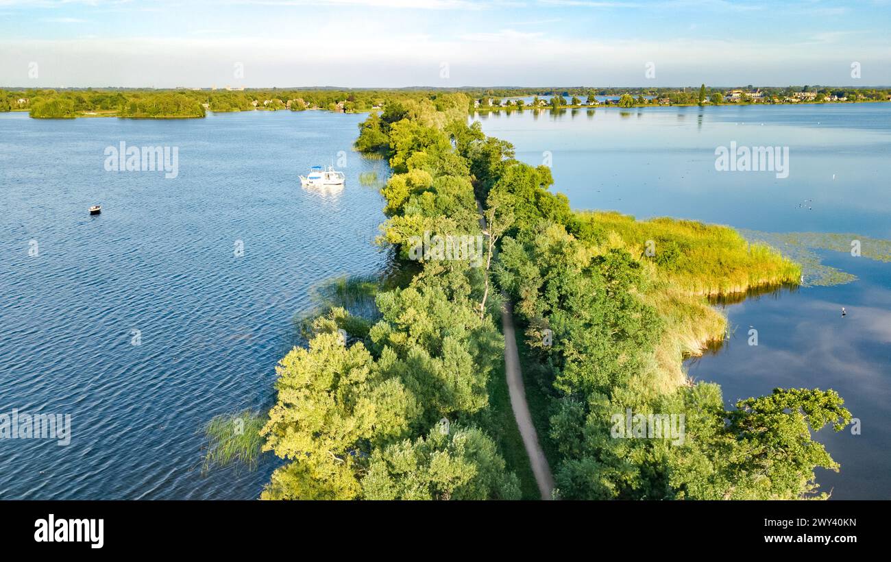 Aerial drone view of path on dam in polder water from above, landscape ...
