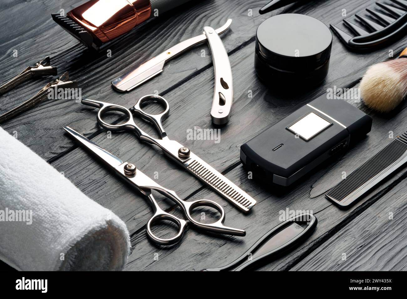 Professional Barber Tools Laid Out on Dark Wooden Surface Stock Photo ...